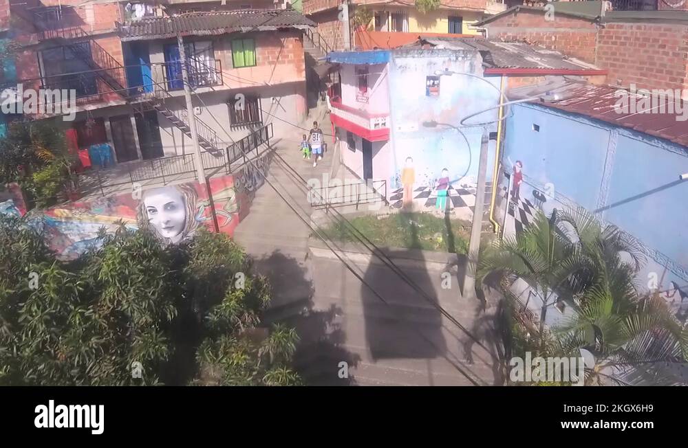 Slums of Medellin passing by seen from a cable car, colombian ghetto ...