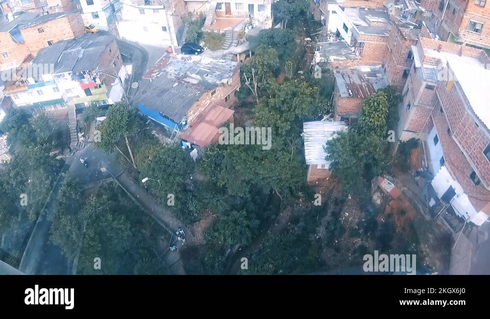 Slums of Medellin passing by seen from a cable car, colombian ghetto ...