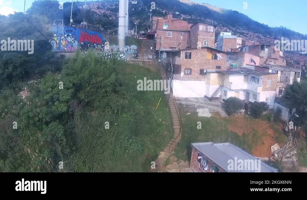 Slums of Medellin passing by seen from a cable car, colombian ghetto ...