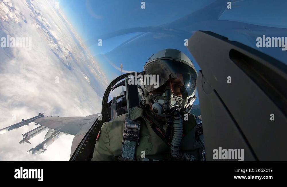 Cockpit footage of F-16 Aggressor pilot banking above clouds during Red Flag Stock Video Footage ...