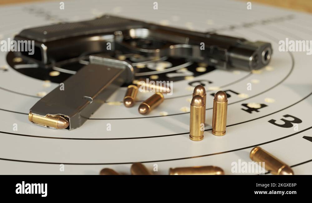 Gun and ammo on the shooting target. 9mm pistol with bullets and ...