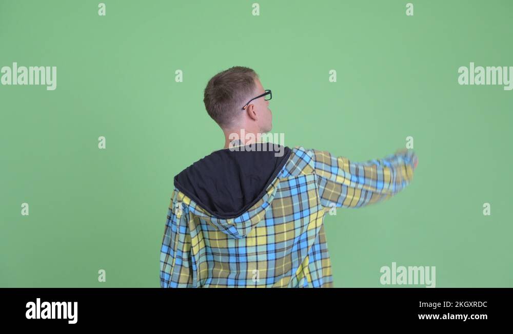 Rear view of nerd man pointing finger and directing Stock Video Footage ...