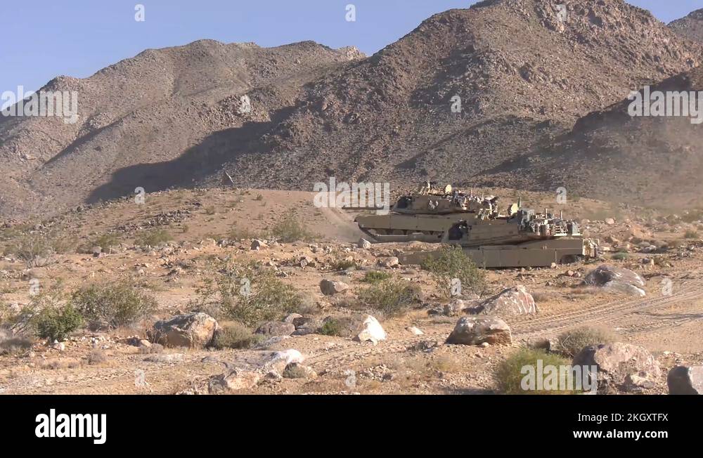 M1A2 Abrams battle tank firing cannon in desert during live fire ...