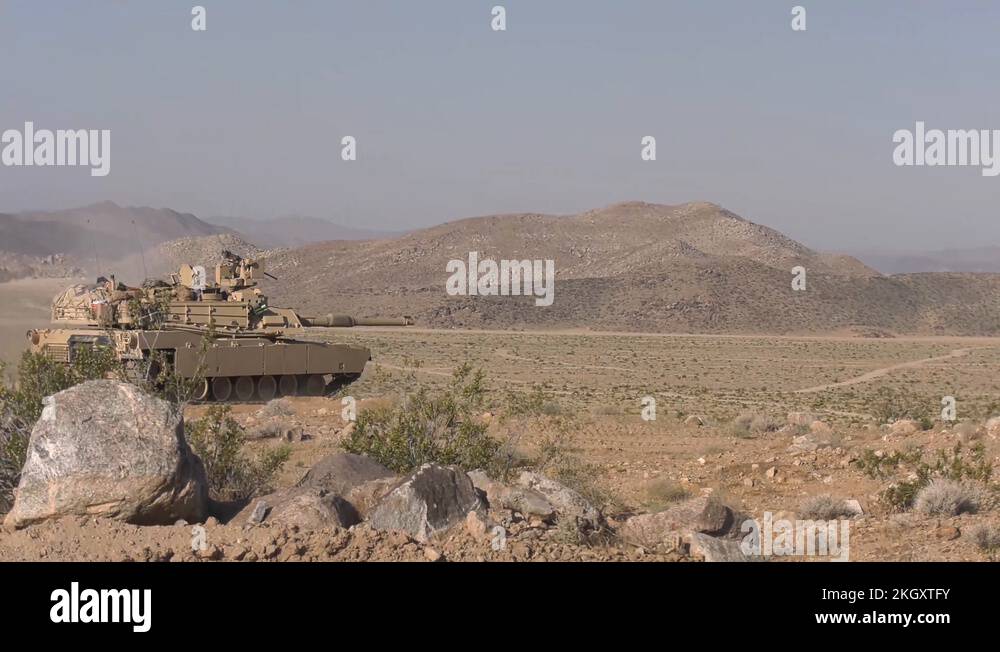 M1A2 Abrams battle tank fires cannon in desert during live fire ...