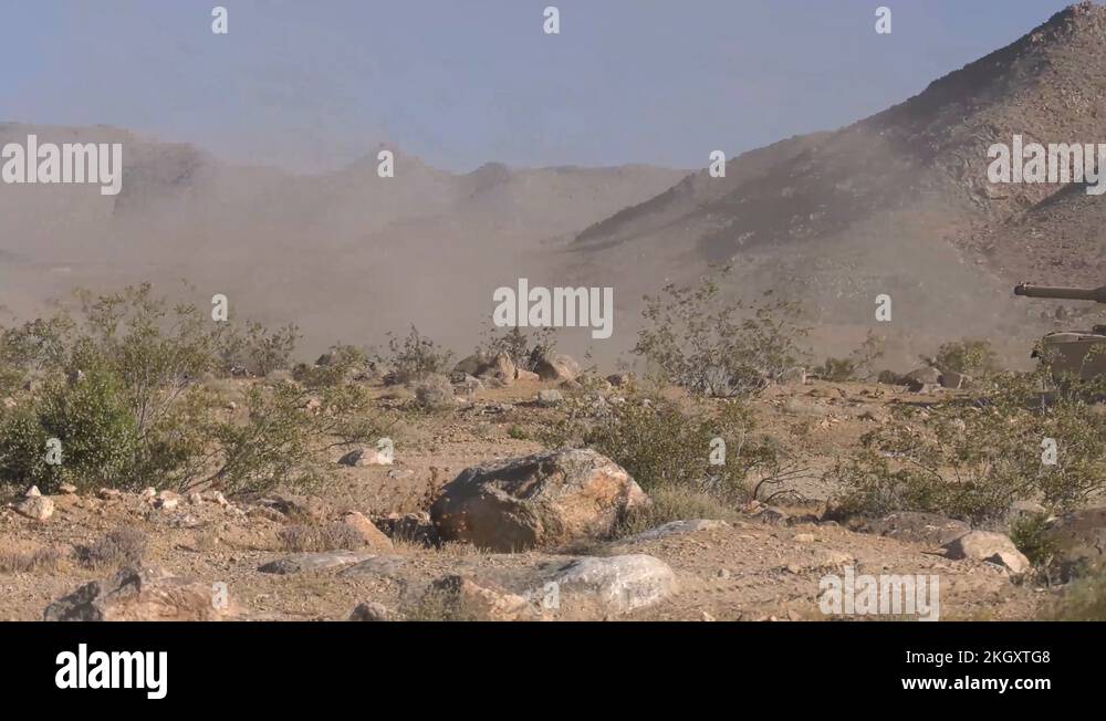 M1A2 Abrams battle tank fires cannon in desert before reversing Stock ...