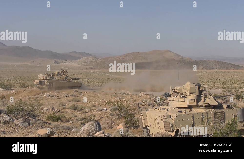 M1A2 Abrams battle tank firing cannon in desert during live fire ...