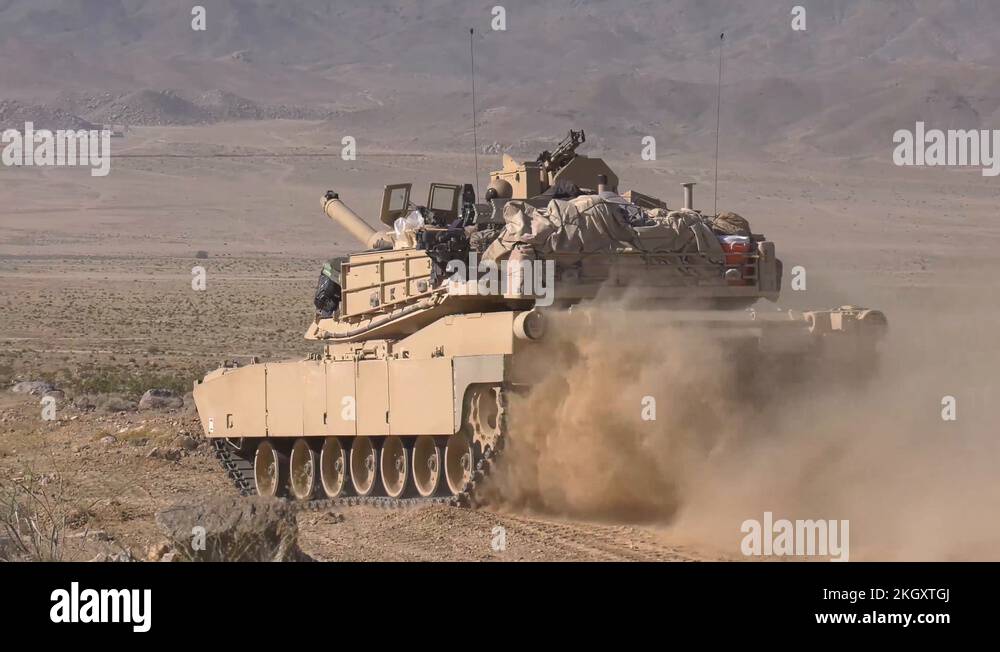 M1A2 Abrams battle tank tracking over sand in desert Stock Video ...