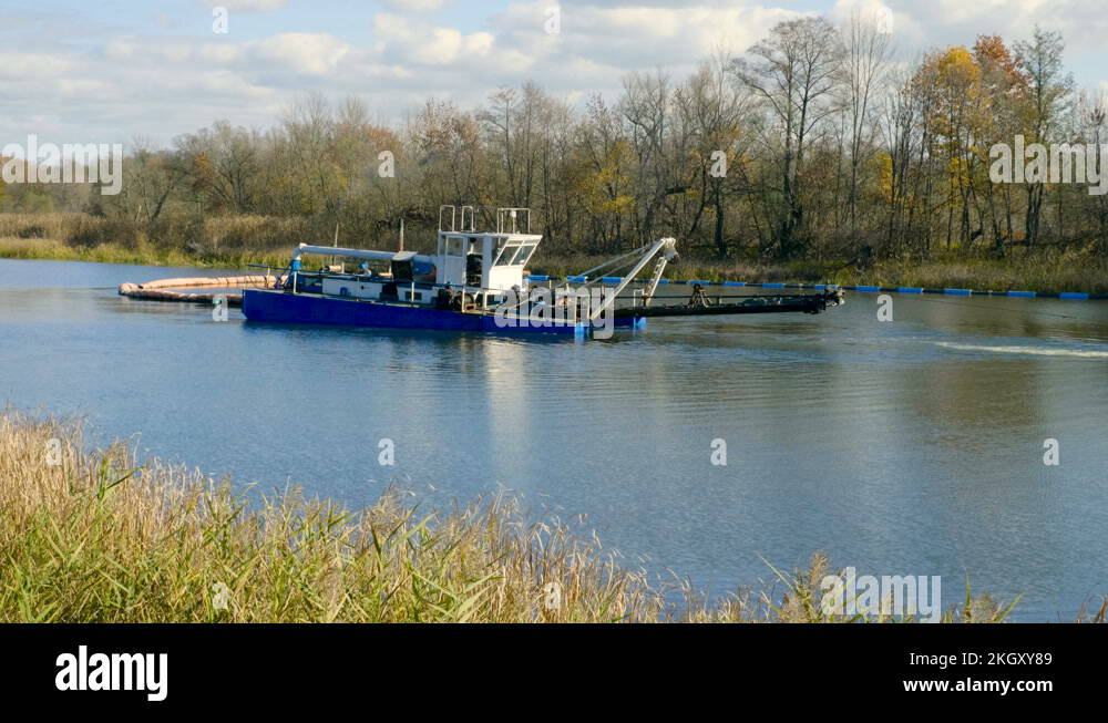 Suction dredger. Ship digging, removing mud, sand from the bottom of a ...