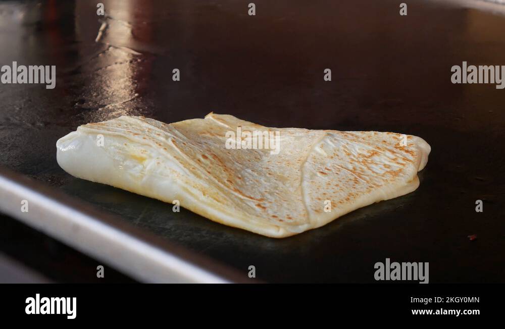 Chef making traditional Indian food called 'Roti Canai'. 4k Stock Video ...