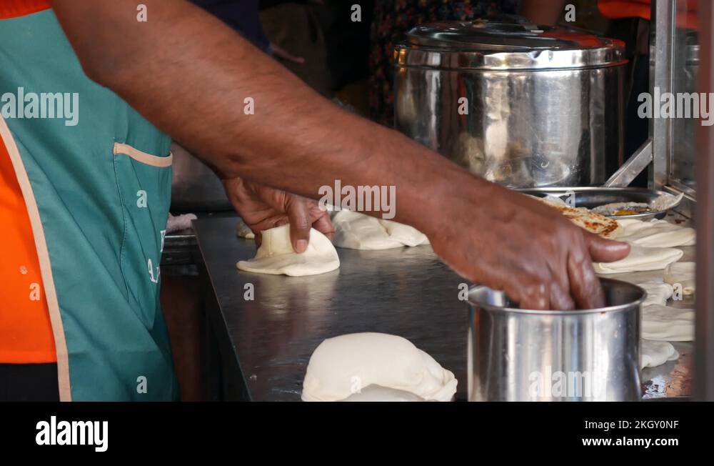 Male hands making traditional Indian food called 'Roti Canai'. 4k Stock ...