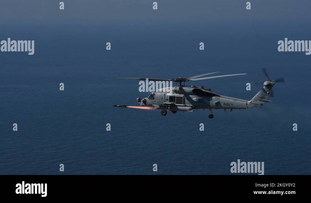 MH-60R Seahawk helicopter fires AGM-114 Hellfire missile Stock Video ...