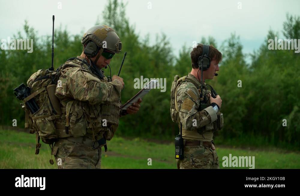 Soldier Reading From Notebook During Close Air Support Exercise For Red