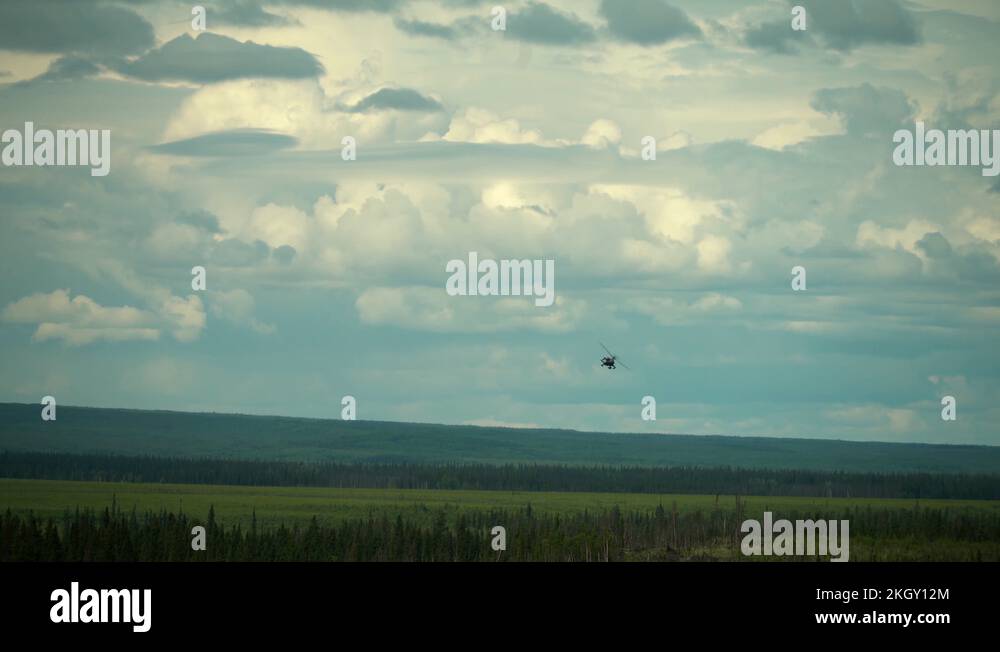 AH-64 Apache helicopter flying during close air support exercise Red ...