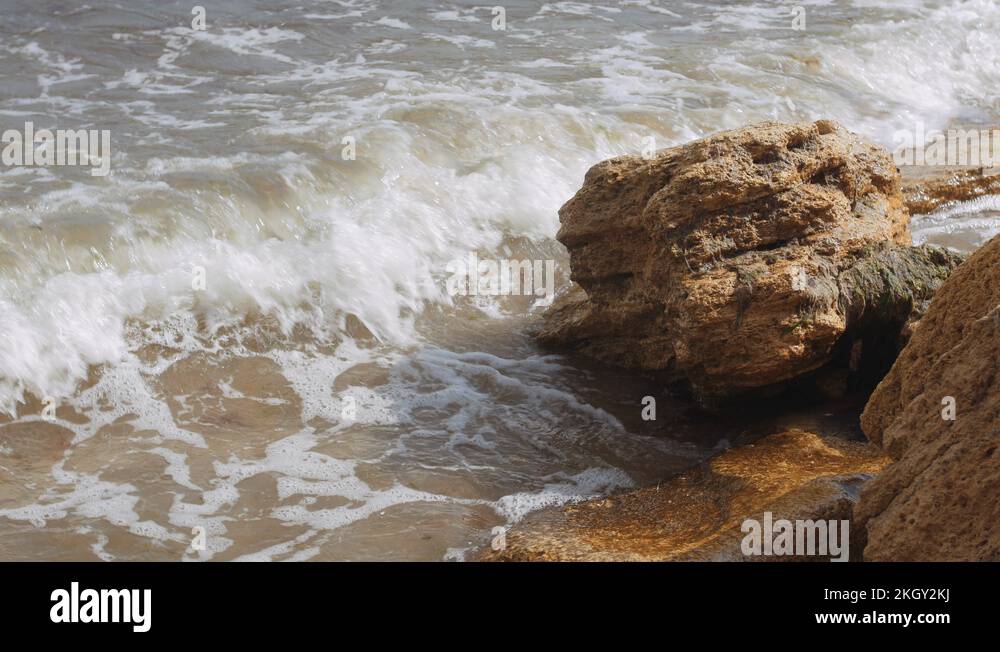 Tide and sea, beach and rock stones background. Sparkling ocean waves ...