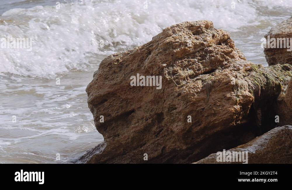 Tide and sea, beach and rock stones background. Sparkling ocean waves ...