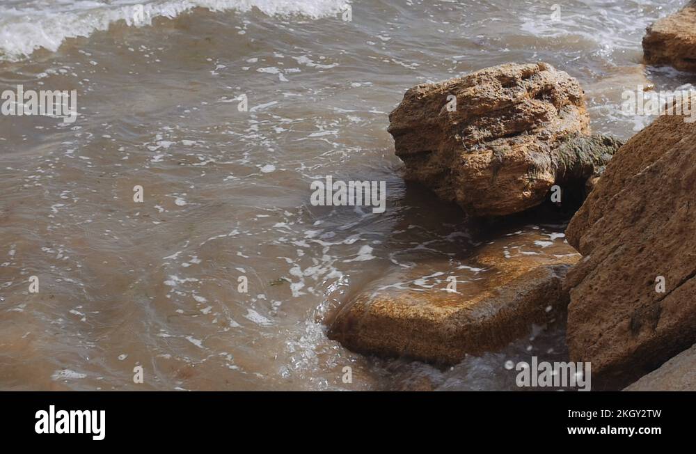 Tide and sea, beach and rock stones background. Sparkling ocean waves ...
