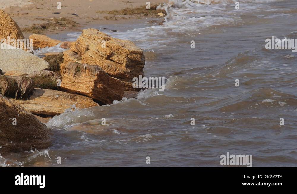 Tide and sea, beach and rock stones background. Sparkling ocean waves ...