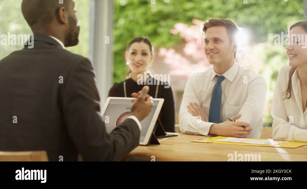 4K Friendly interview team listening to businessman candidate & asking ...