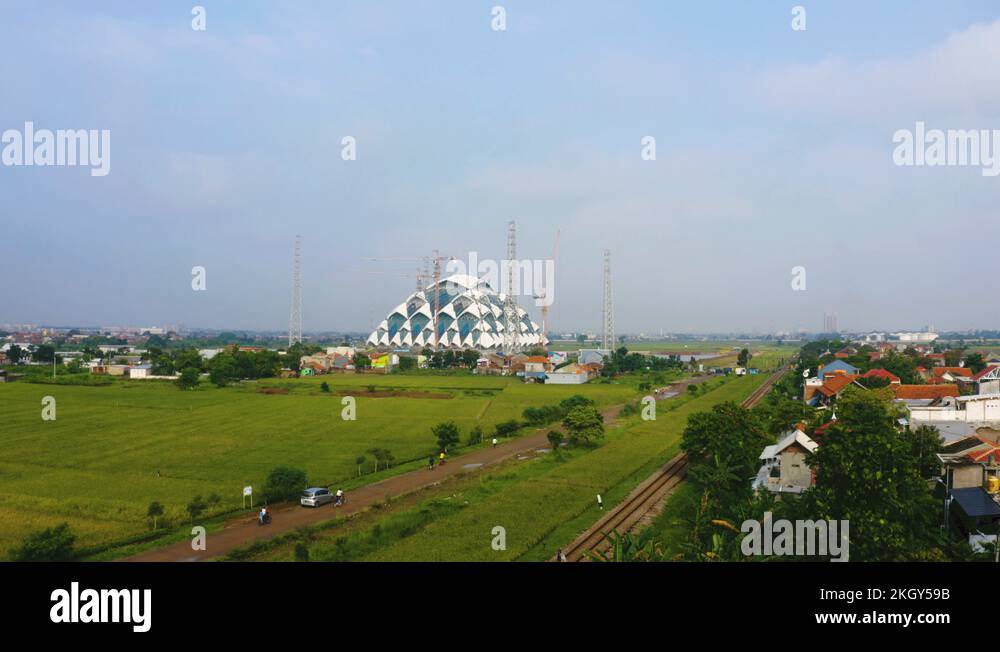 Farmland with Al Jabbar Great Mosque background Stock Video Footage - Alamy