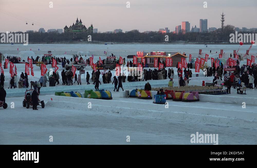People visit entertainment area, frozen Songhua river Harbin ice ...