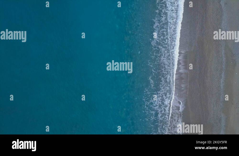Pure calm sea from bird's eye view, drone camera flies slowly over ...