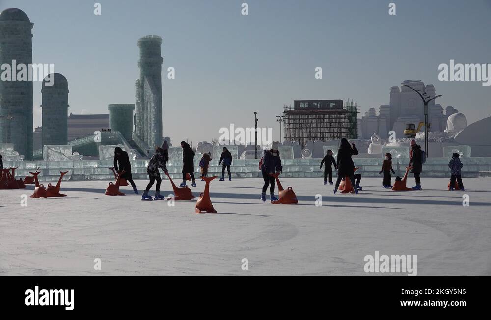 Chinese tourists ice skating at famous Harbin ice and snow festival ...