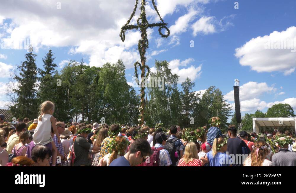 People celebrating the Swedish holiday midsummer at Skansen Park in ...