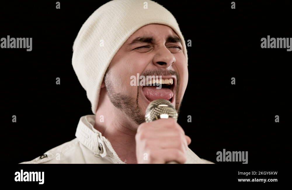 Close-up Frontman vocalist rock pop with a stylish beard in white ...