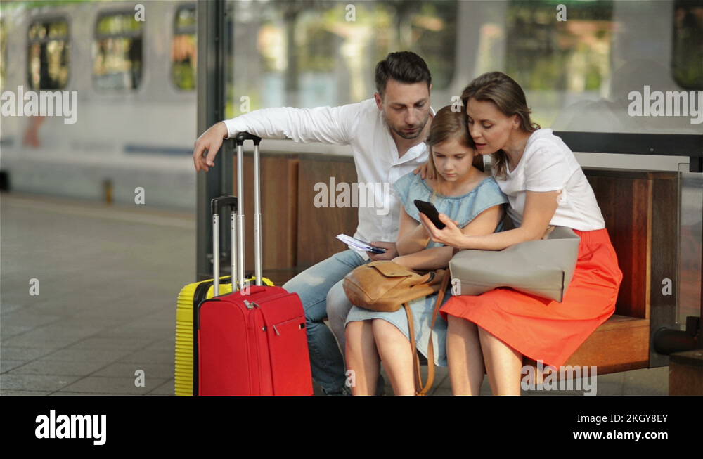 Mother And Father With Cute Daughter Are Sitting In The Waiting Room of ...