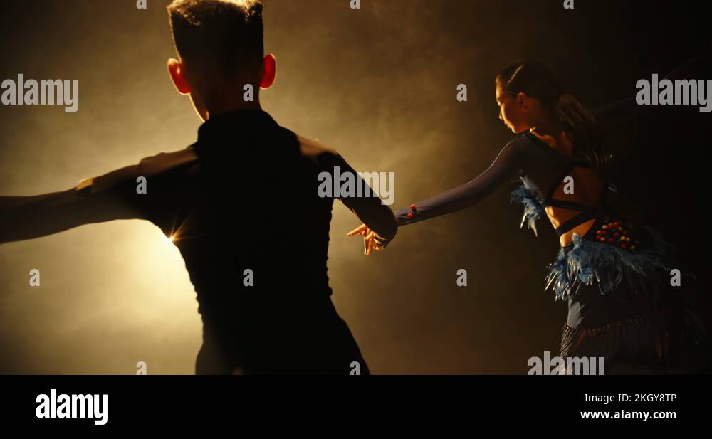 Two asian kids performing a ballroom dance on stage, fulffilling ...