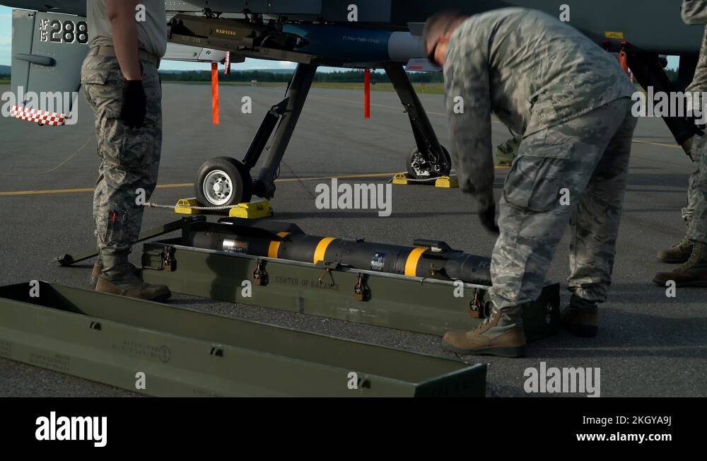U.S. Air Force weapons specialists load munitions onto MQ-9 Reaper UAV ...