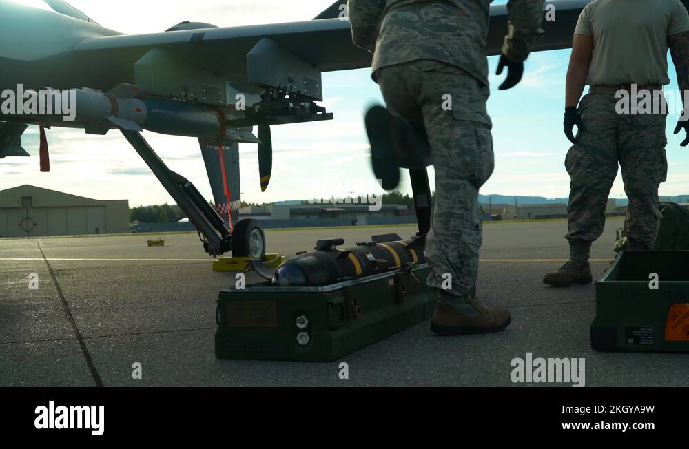 U.S. Air Force weapons specialists unpacking munitions for MQ-9 Reaper ...