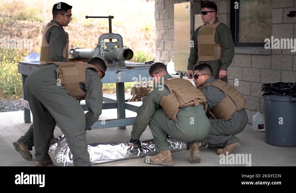 Marine EOD technicians wrapping MK22 Mod 4 rocket motor in silver foil ...