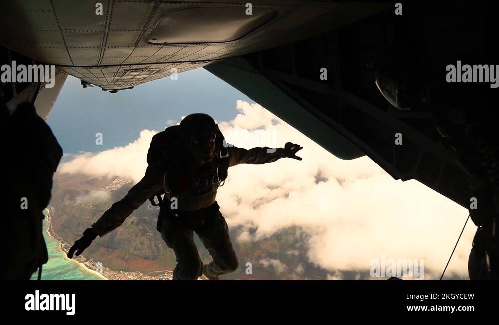 Special operations parachutists jumping from rear ramp of CH-53 Super ...