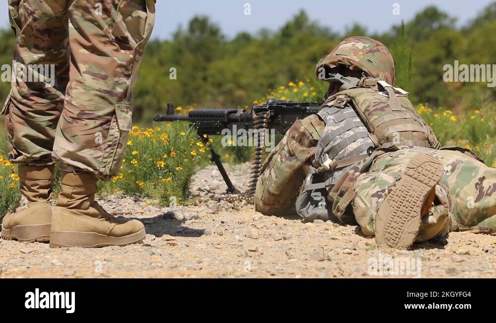 Soldier firing heavy machine gun Stock Video Footage - Alamy