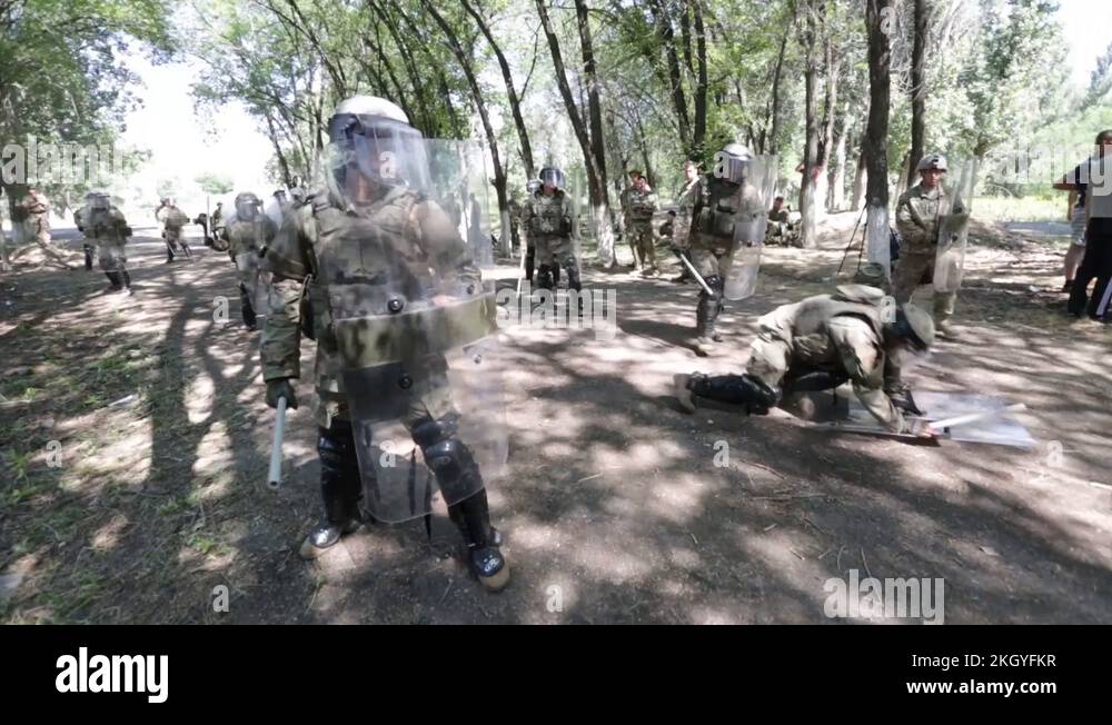 Soldiers running with riot shields during exercise Steppe Eagle Stock ...