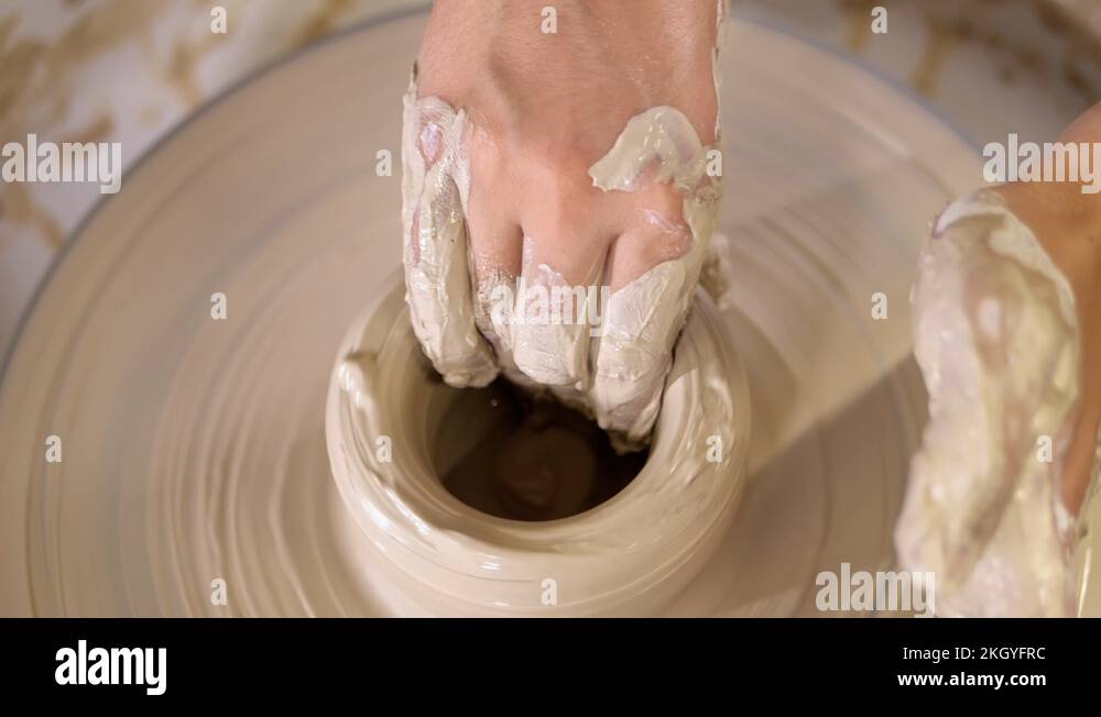 Traditional pottery making,man teacher shows the basics of pottery in ...