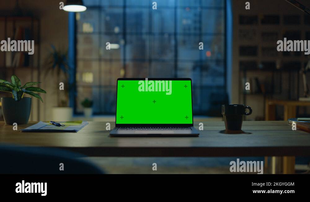 Mock-up Green Screen Laptop Standing on the Desk in the Modern Creative ...