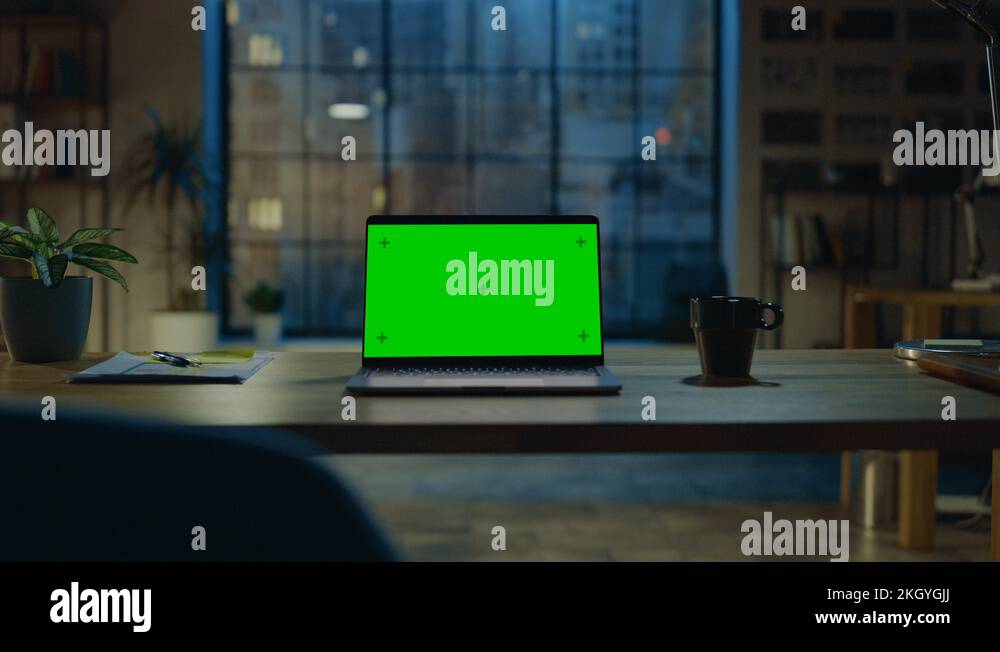 Mock-up Green Screen Laptop Standing on the Desk in the Modern Creative ...