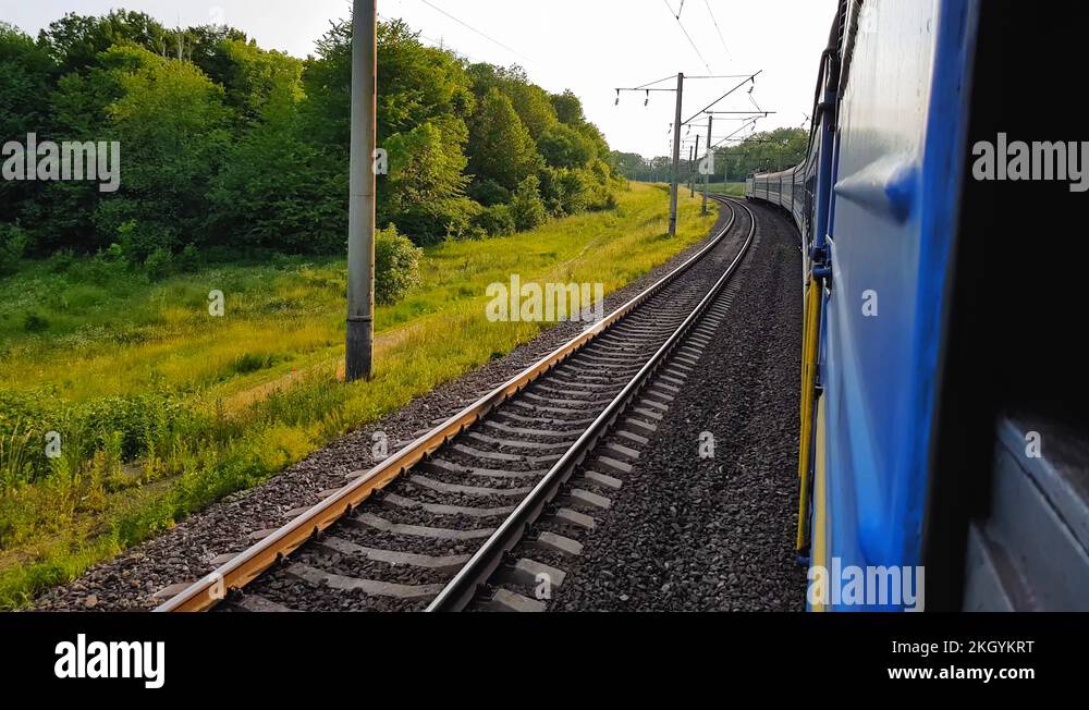 The passenger train returns to the left. The view from the window of ...