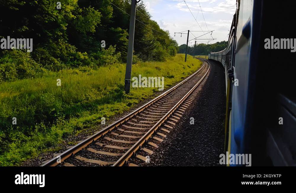 The passenger train returns to the left. The view from the window of ...