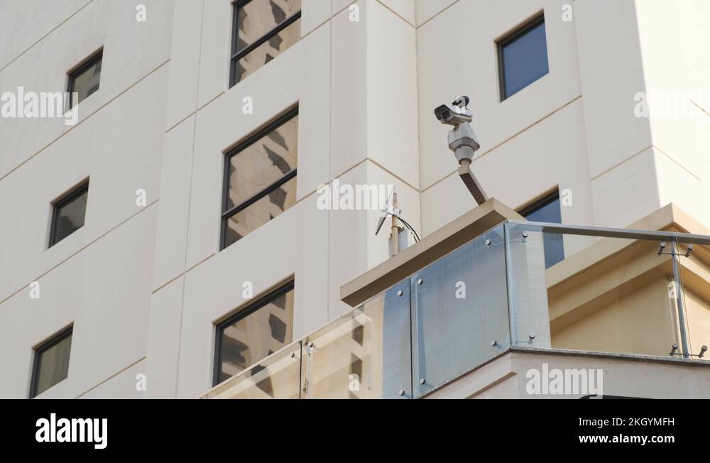 Surveillance camera installed on a high-rise apartment building Stock ...