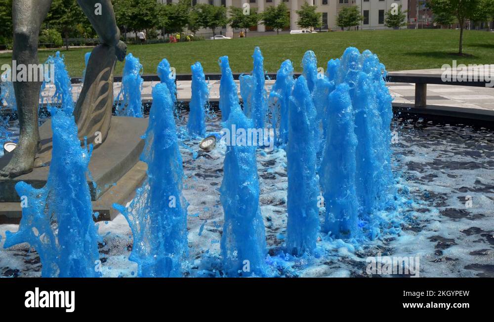 Blue water fountain with Runner Statue at Kiener Plaza Park in St ...