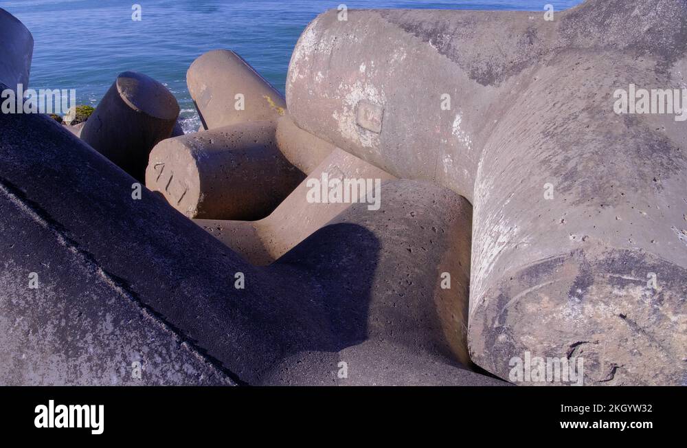 GIANT CONCRETE JACKS CREATE AN OCEAN BREAKWALL. 4K SLIDER SHOT Stock ...