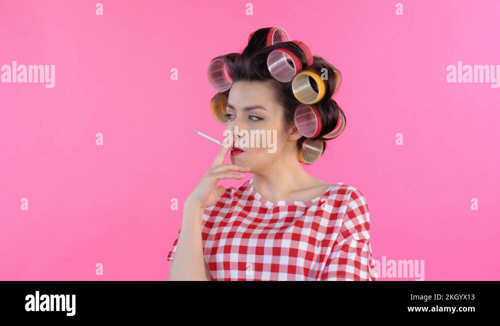 Woman in Hair Rollers Smoking Cigarette Stock Video Footage - Alamy