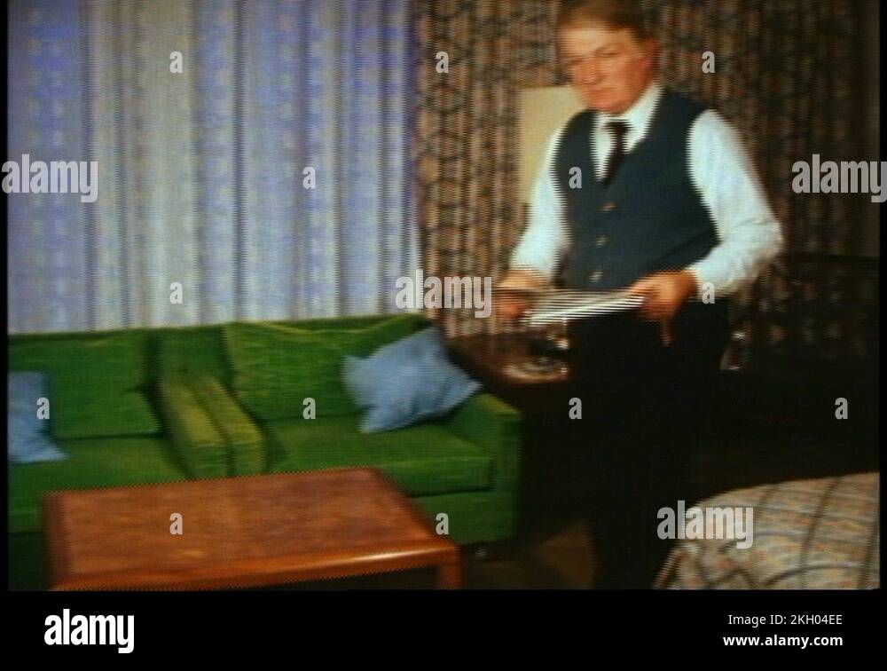 QUEEN ELIZABETH 2, 1982, QE2 Cabin steward lays QE2 times onto coffee ...