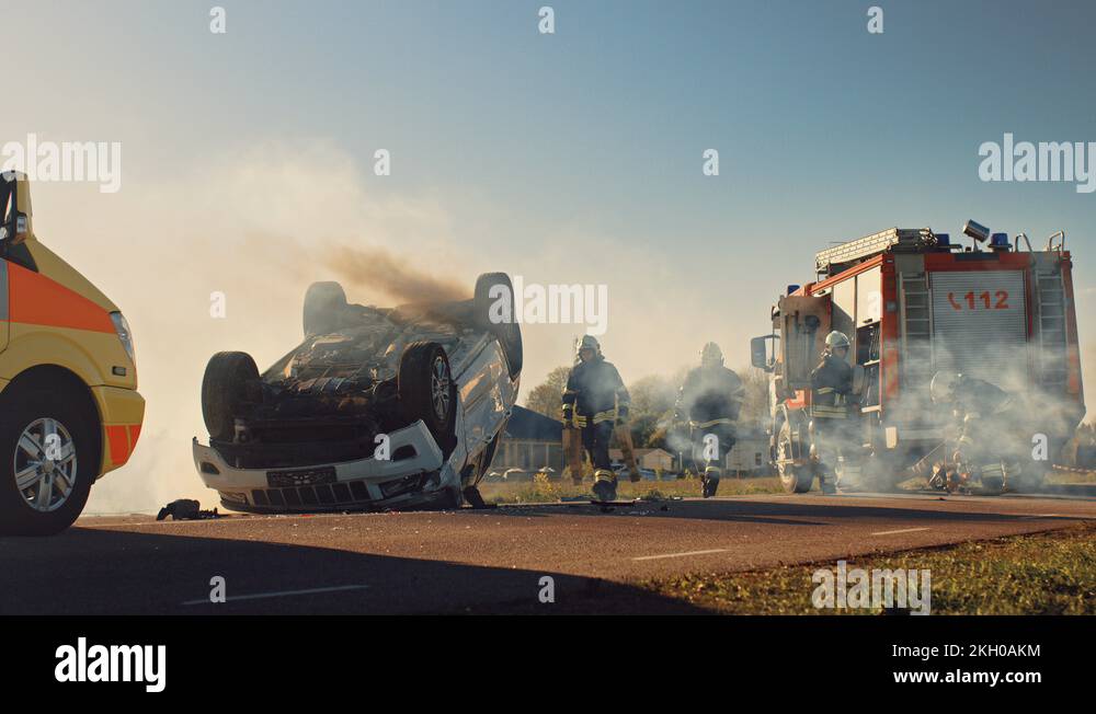 On Car Crash Traffic Accident Scene: Paramedics and Firefighters Rescue ...