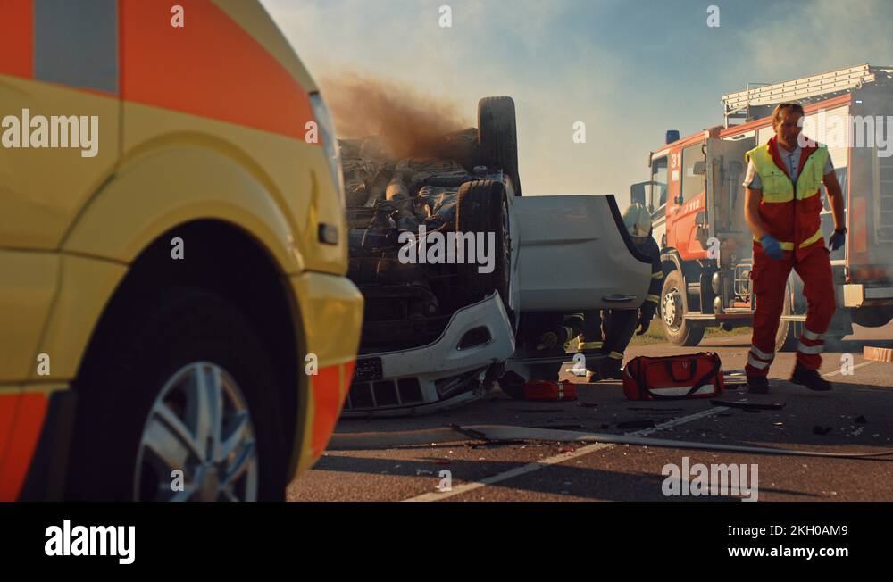 On Car Crash Traffic Accident Scene: Paramedics and Firefighters Rescue ...