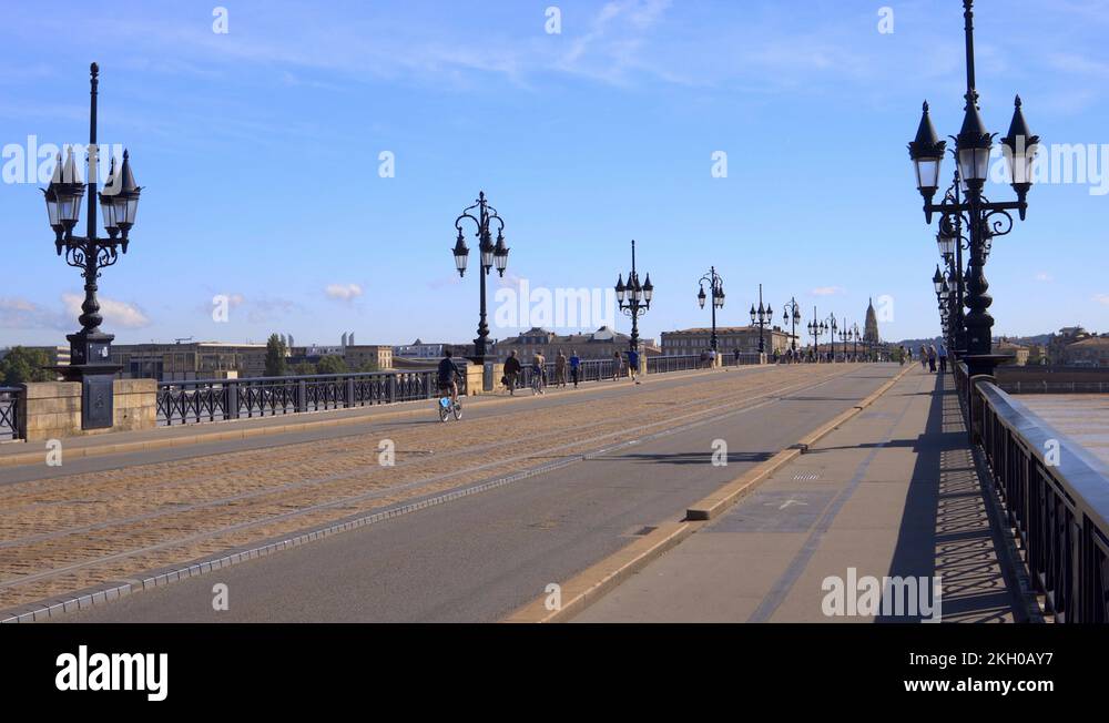 Tramway crossing the Pont de pierre bridge in the streets of Bordeaux ...