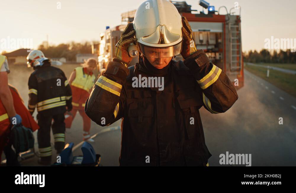 Portrait of the Brave Firefighter Taking Off His Helmet. Heroes Save ...